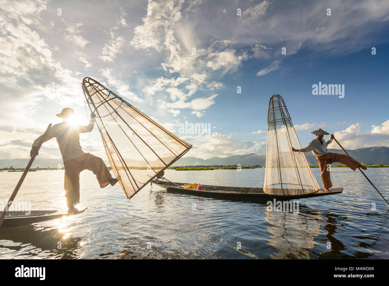 Nyaung Shwe: Fisherman at Inle Lake with traditional Intha conical net ...