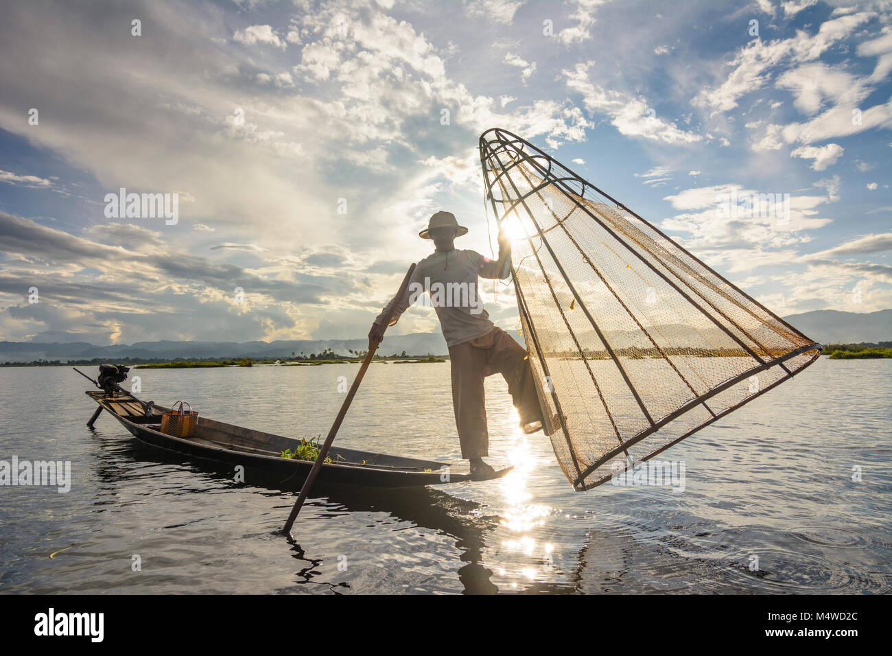 Nyaung Shwe: Fisherman at Inle Lake with traditional Intha conical net ...