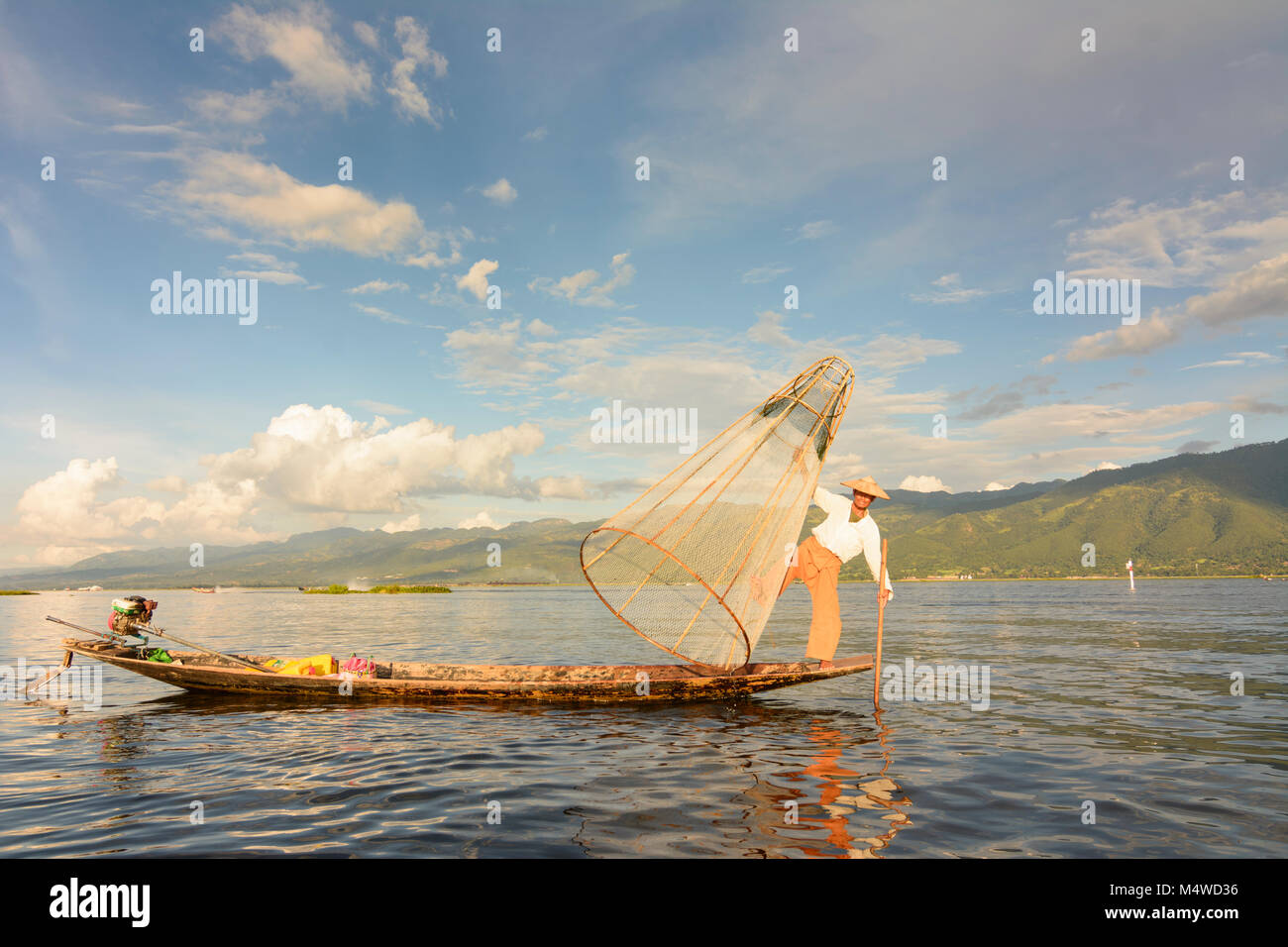 Nyaung Shwe: Fisherman at Inle Lake with traditional Intha conical net ...