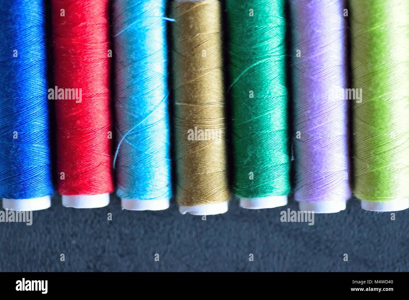 Macro background texture of colorful sewing threads Stock Photo - Alamy