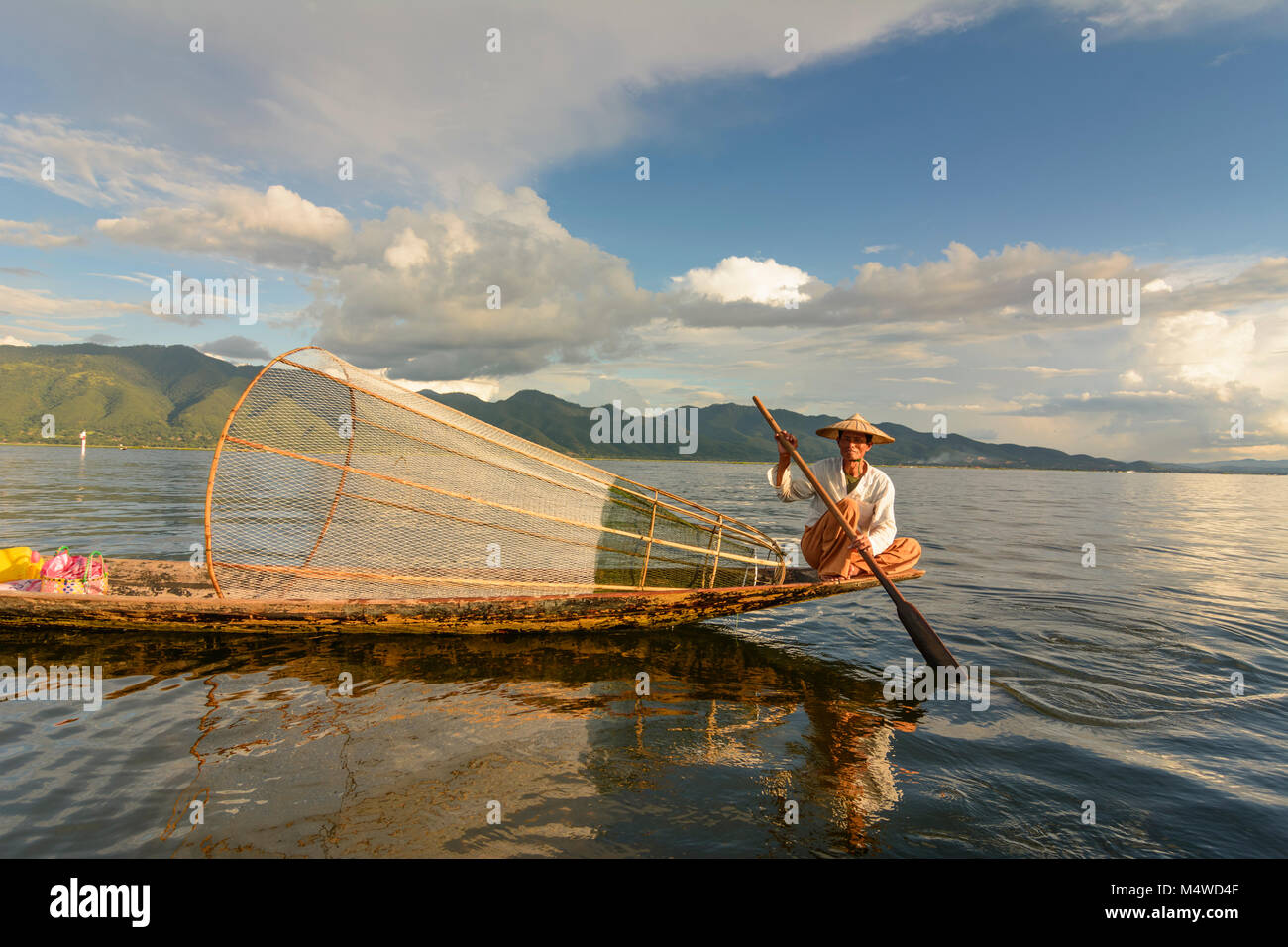 Nyaung Shwe: Fisherman at Inle Lake with traditional Intha conical net ...