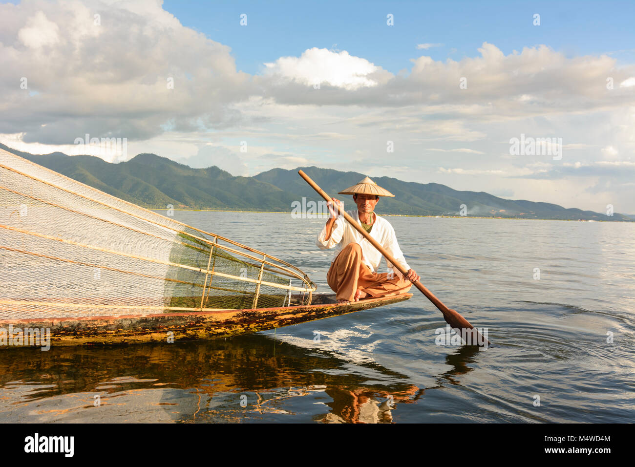 Nyaung Shwe: Fisherman at Inle Lake with traditional Intha conical net ...