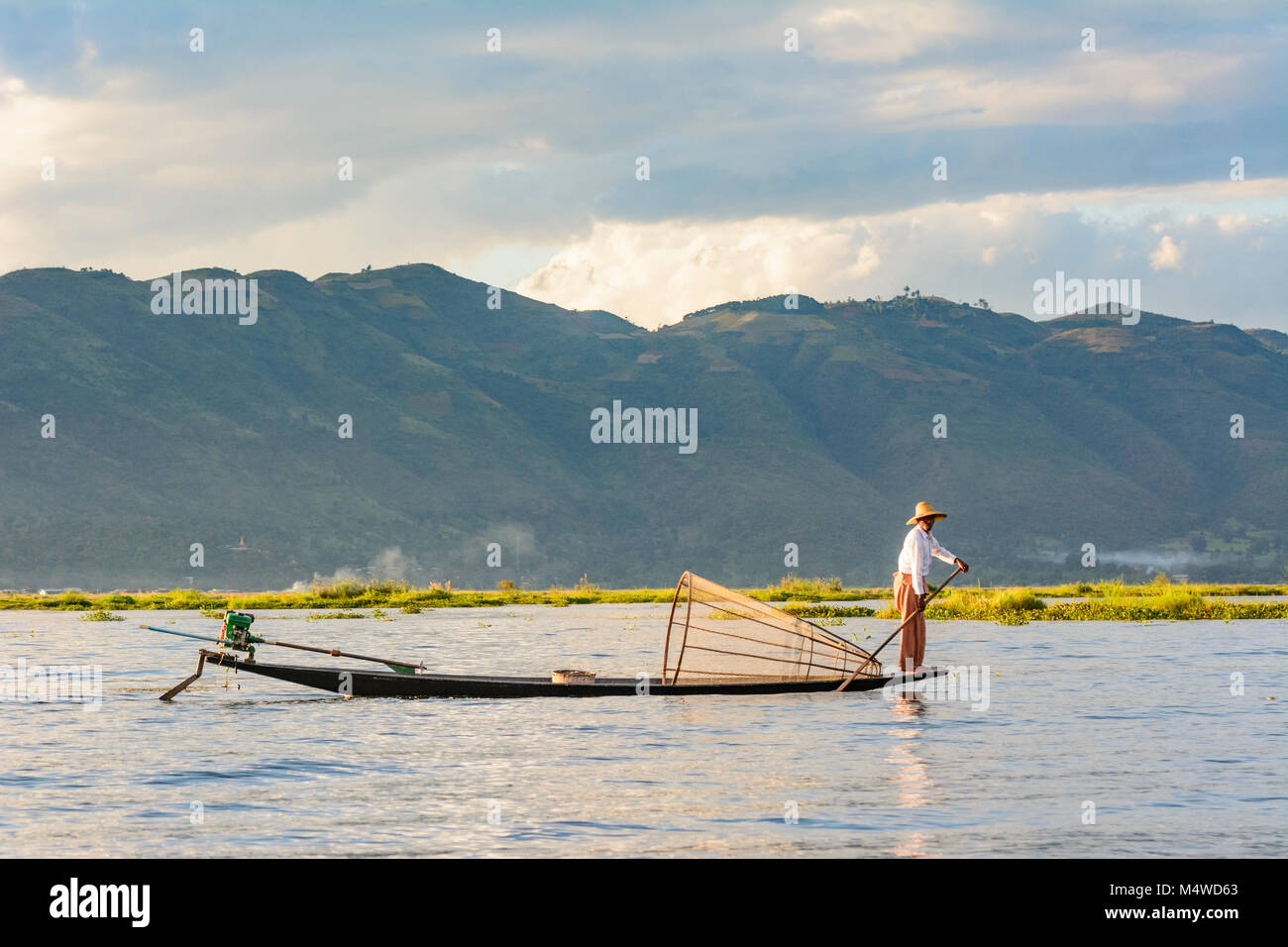Nyaung Shwe: Fisherman at Inle Lake with traditional Intha conical net ...