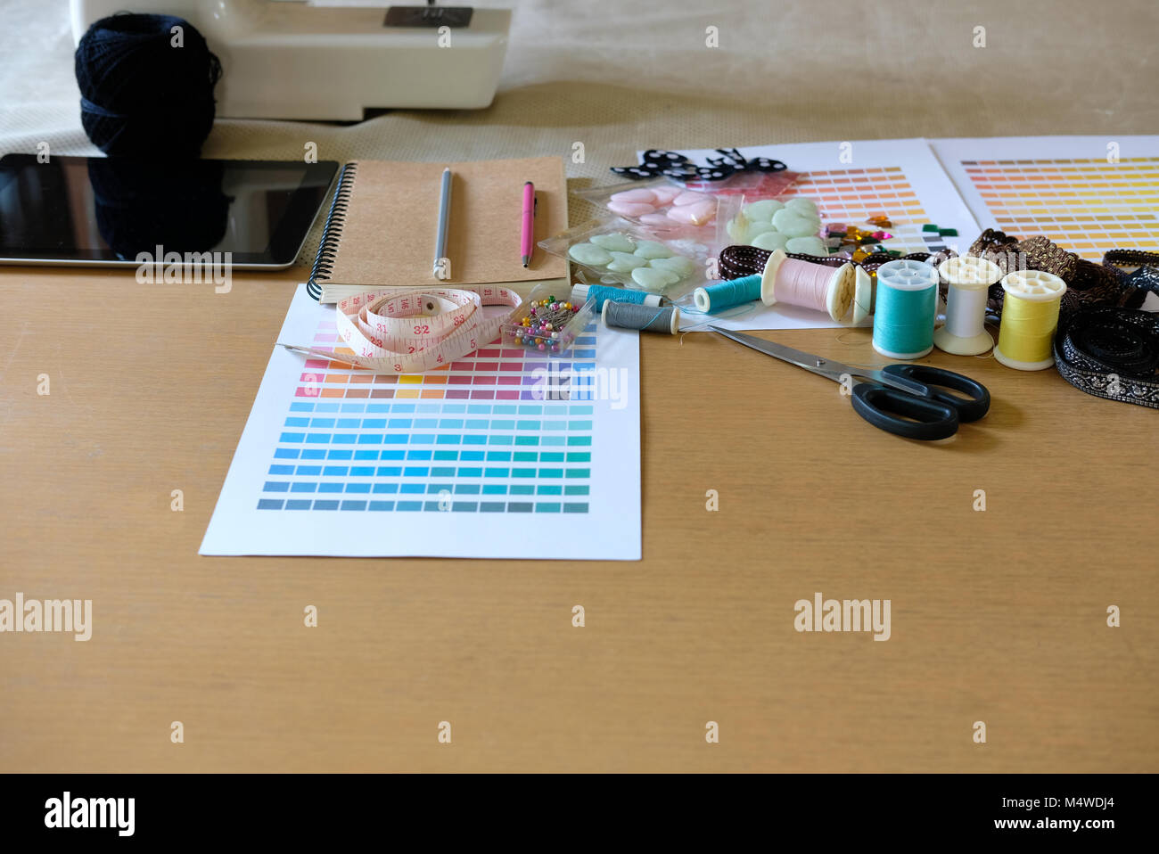 equipment on fashion designer desk in studio. design things in atelier ...