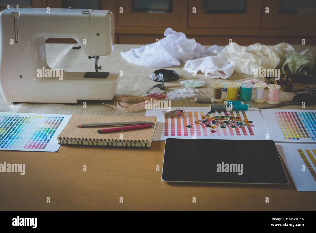 equipment on fashion designer desk in studio. design things in atelier ...