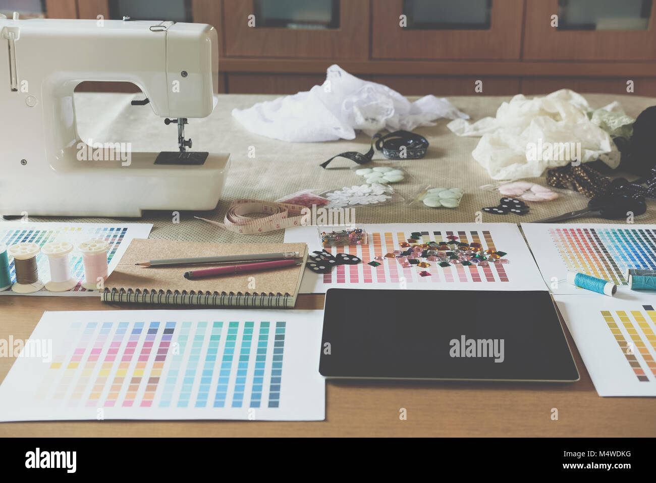 equipment on fashion designer desk in studio. design things in atelier ...