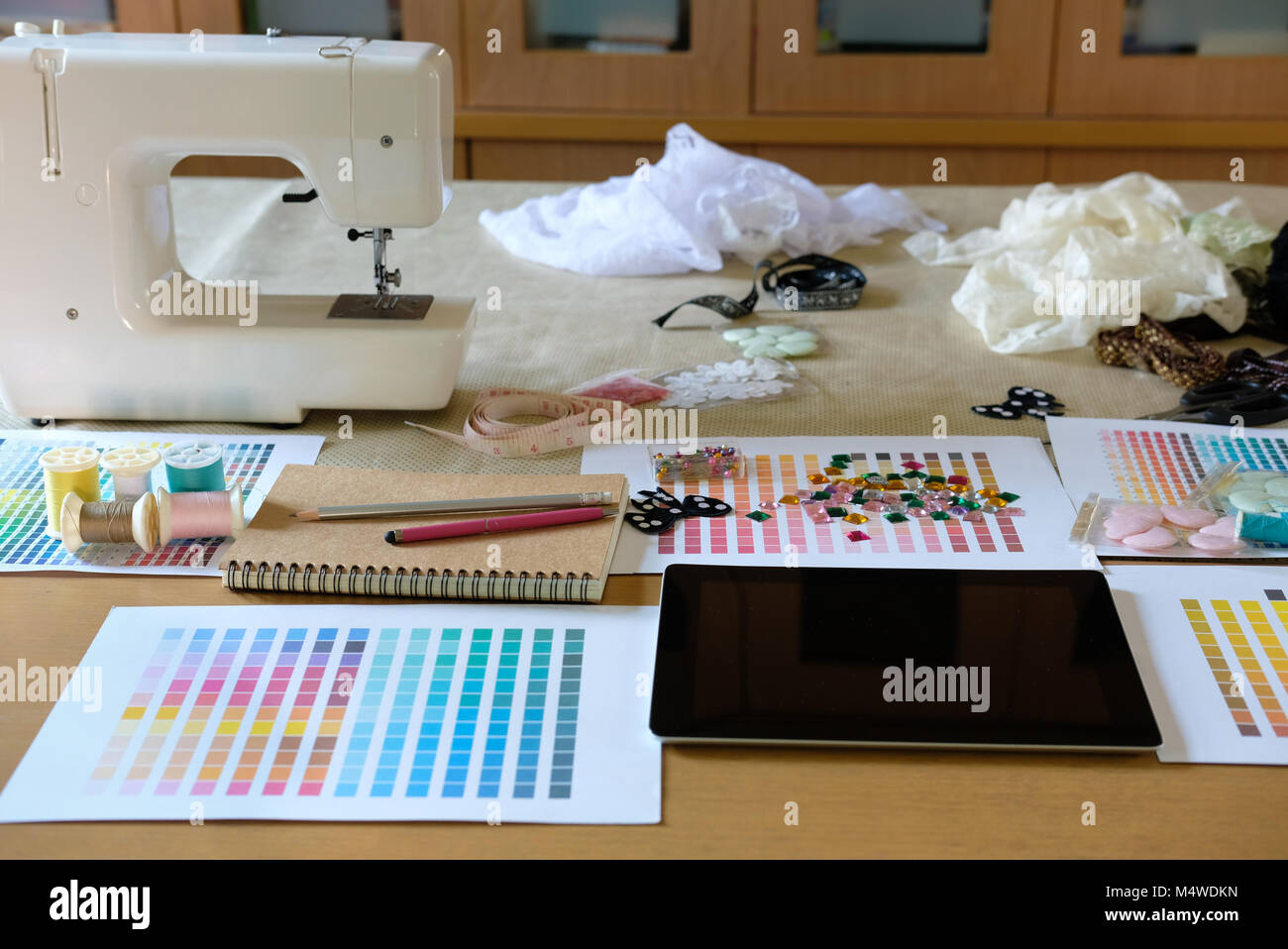 equipment on fashion designer desk in studio. design things in atelier ...