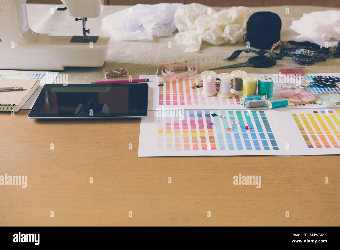 equipment on fashion designer desk in studio. design things in atelier ...