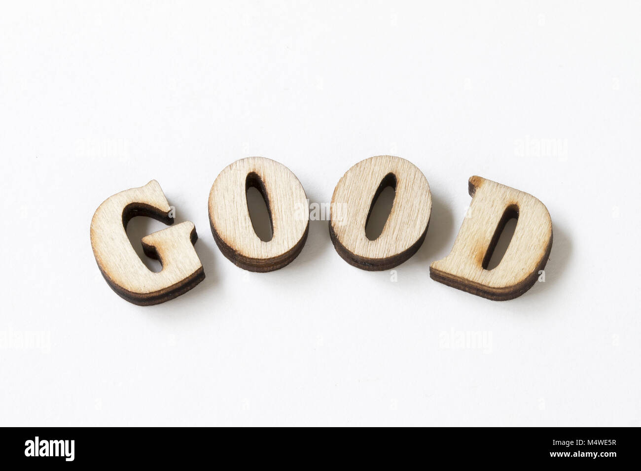 GOOD, Wood letters good on White background Stock Photo - Alamy