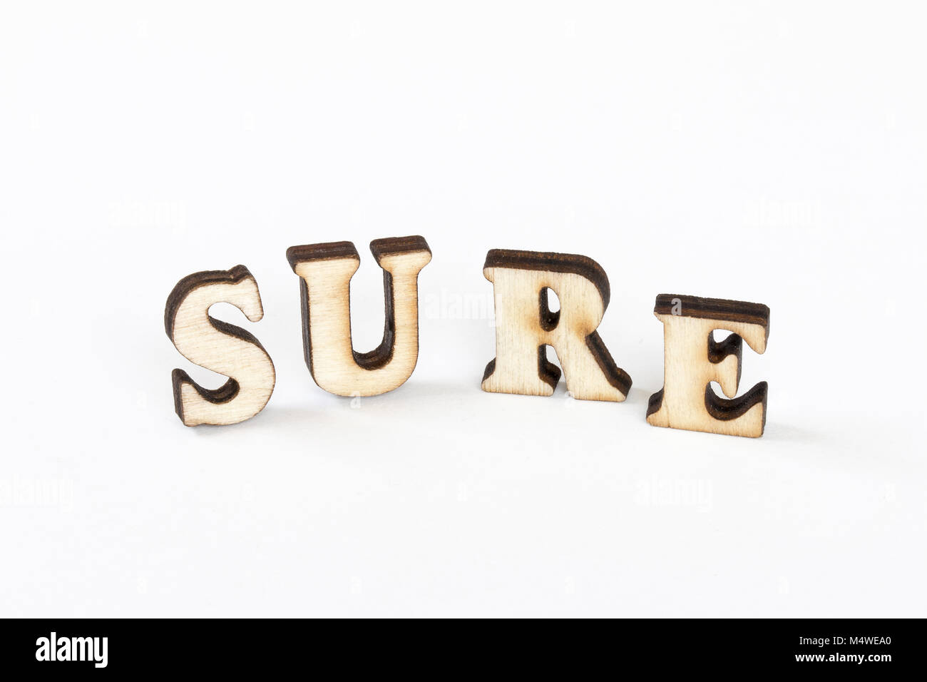 sure, Wood letters SURE on White background Stock Photo - Alamy