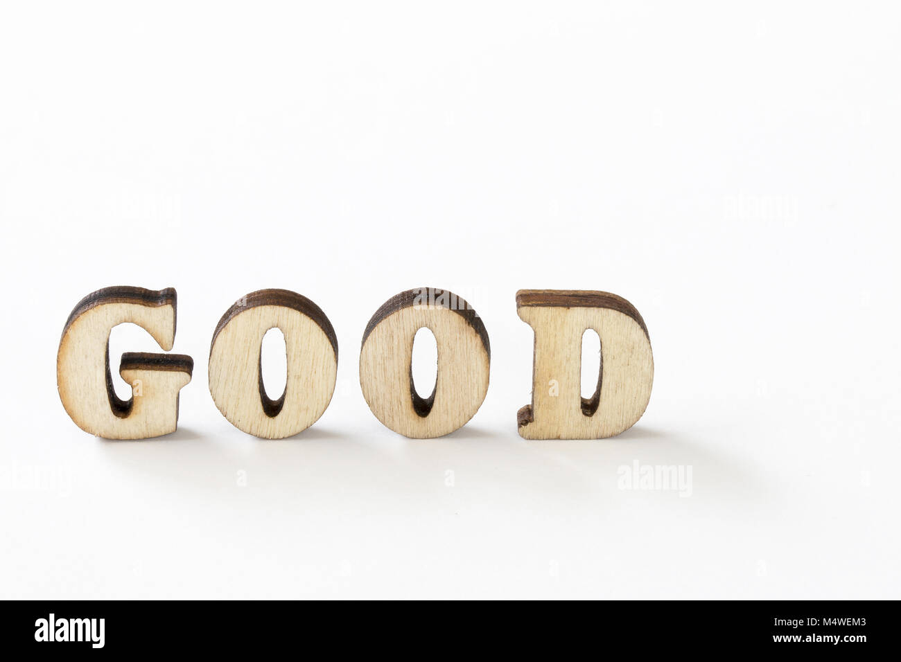 GOOD, Wood letters good on White background Stock Photo - Alamy