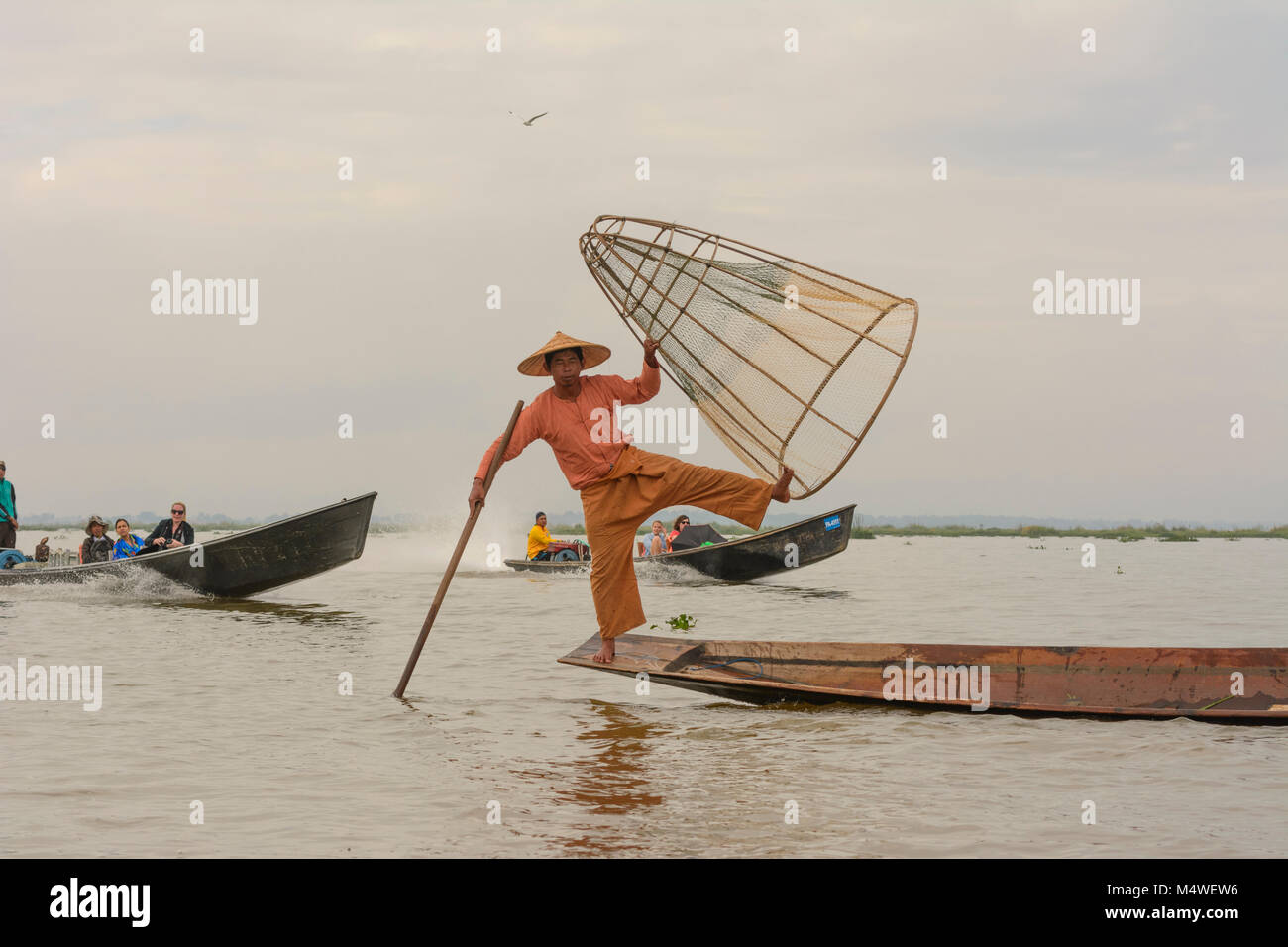 Nyaung Shwe: Fisherman at Inle Lake with traditional Intha conical net ...