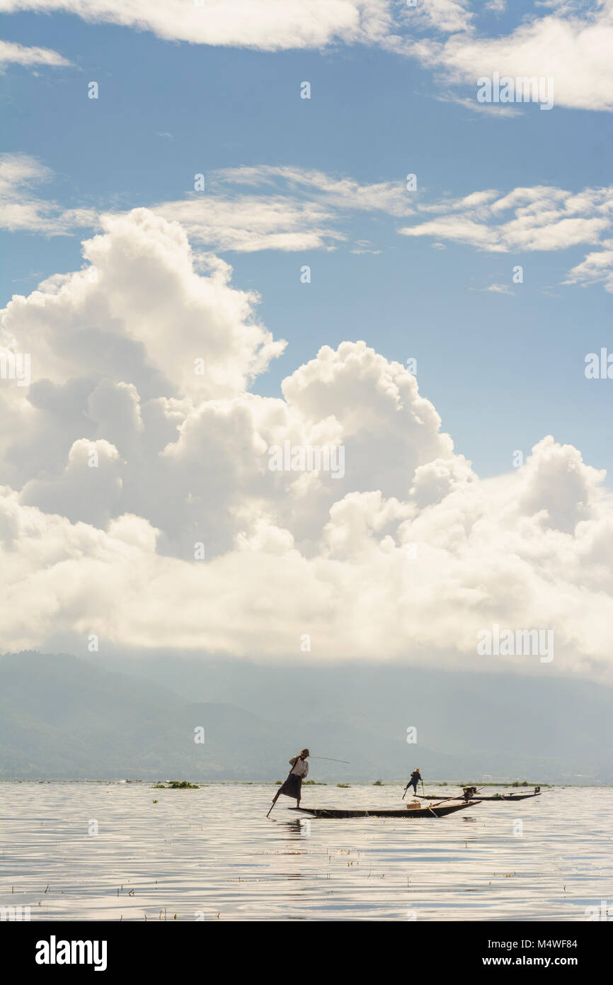 Nyaung Shwe: fisherman at Inle Lake, fishing net, leg rowing style ...