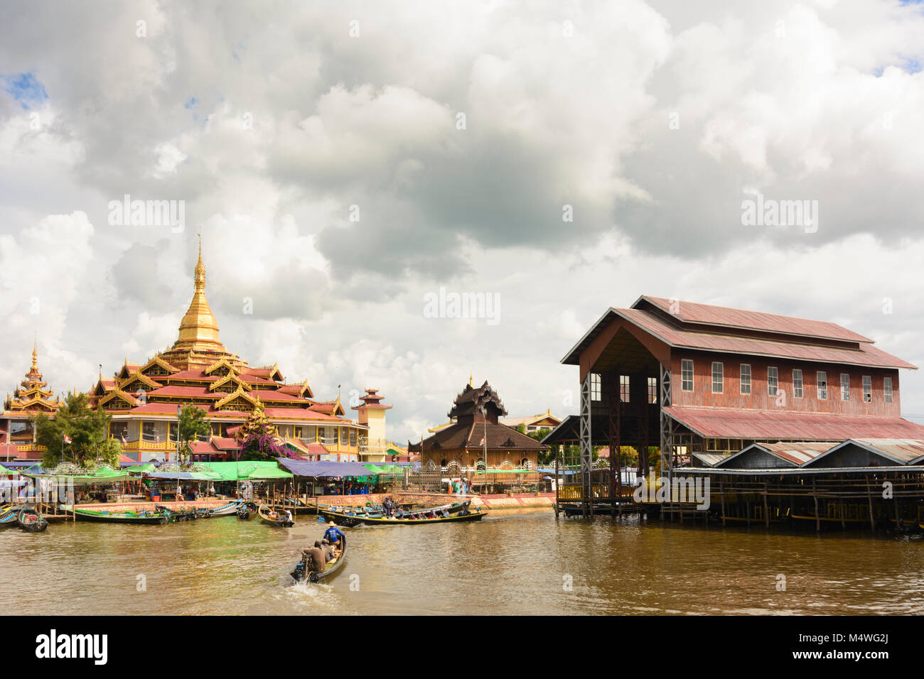 Tha Lay: temple pagoda Phaung Daw Oo Paya, boat, canal, boat house of procession barge (right ...