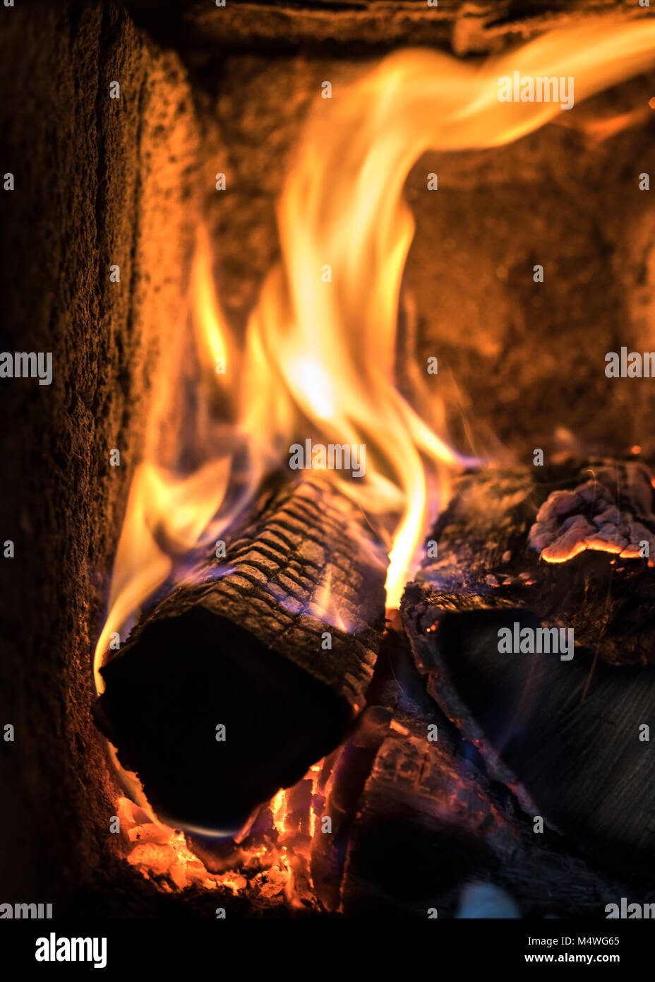 Close up photo of red flame on logs in the stove Stock Photo - Alamy