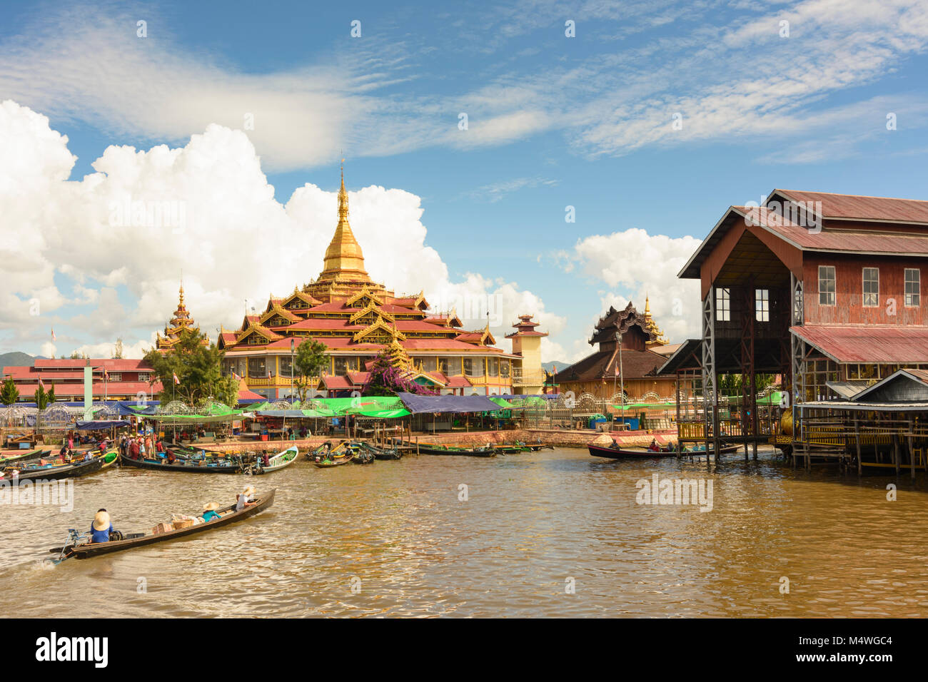 Tha Lay: temple pagoda Phaung Daw Oo Paya, boat, canal, boat house of procession barge (right ...