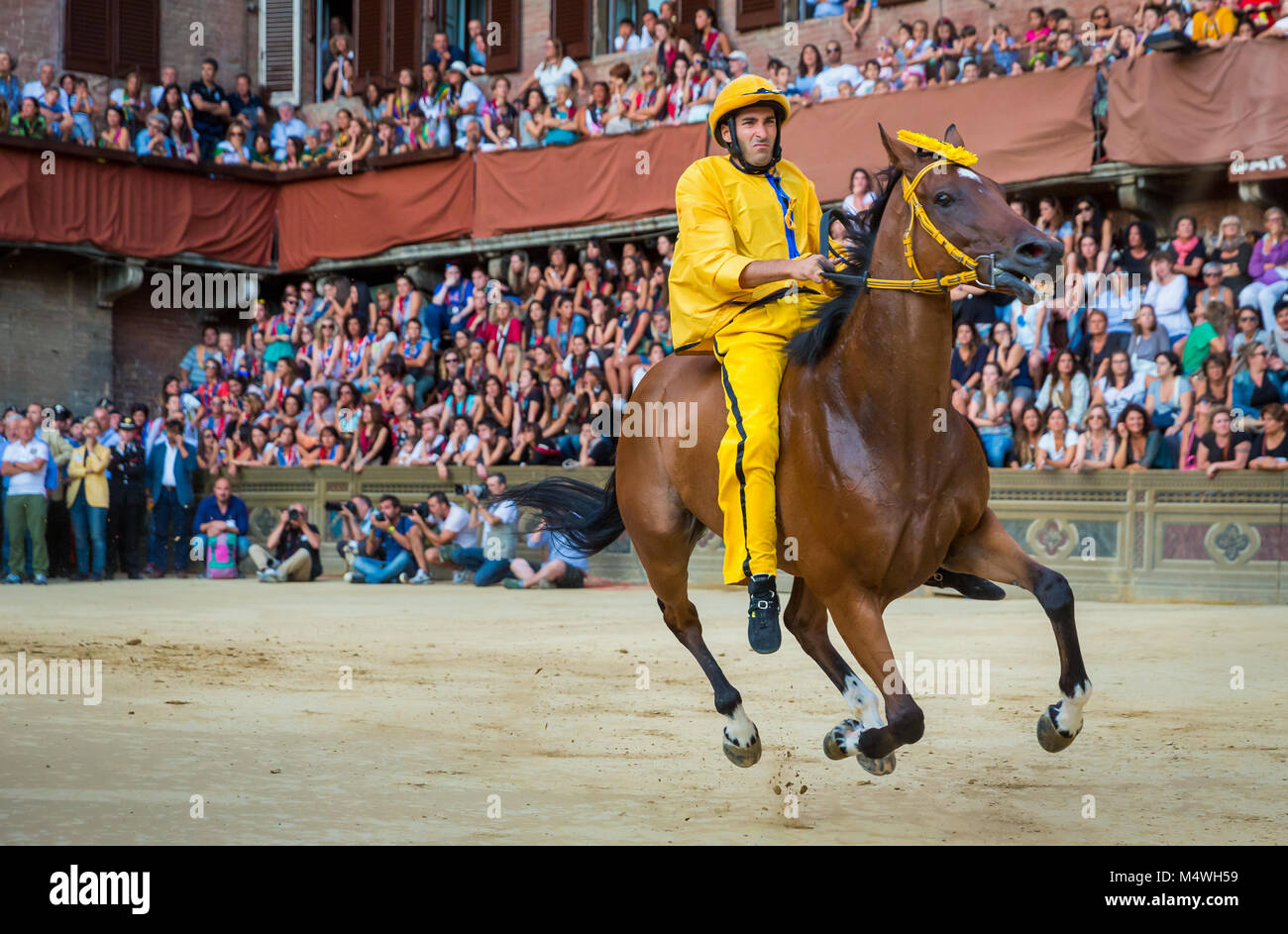 The Palio di Siena horse race on Piazza del Campo, Siena, Tuscany ...