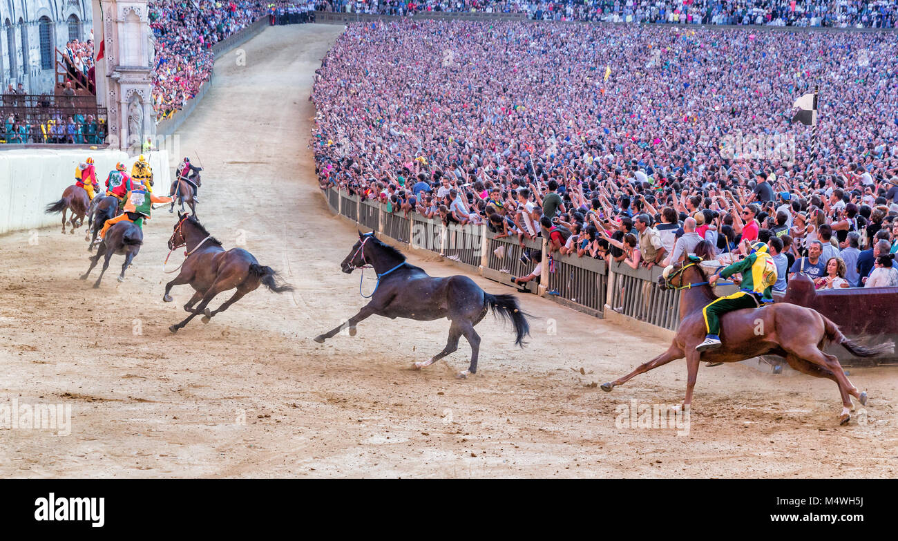 The Palio di Siena horse race on Piazza del Campo, Siena, Tuscany ...