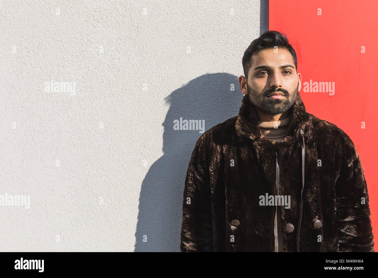 Handsome Indian man posing in an urban context. Street fashion and ...