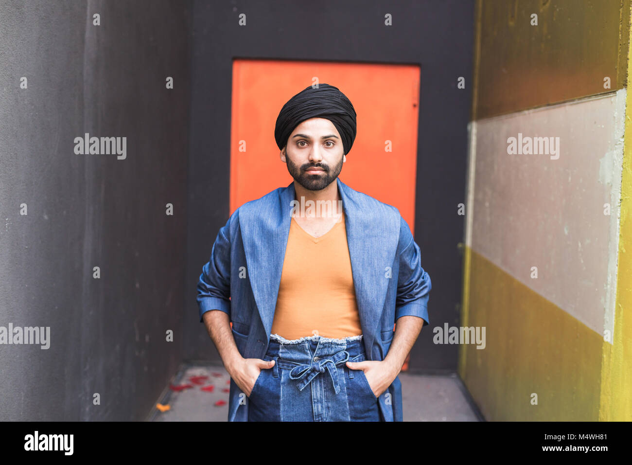 Handsome Indian man posing in an urban context. Street fashion and ...