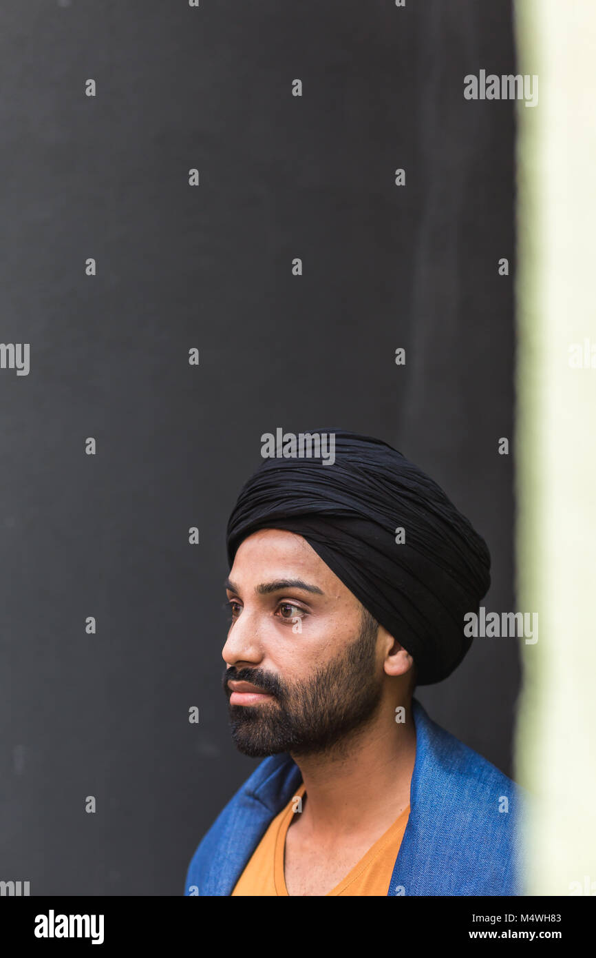 Handsome Indian man posing in an urban context. Street fashion and ...