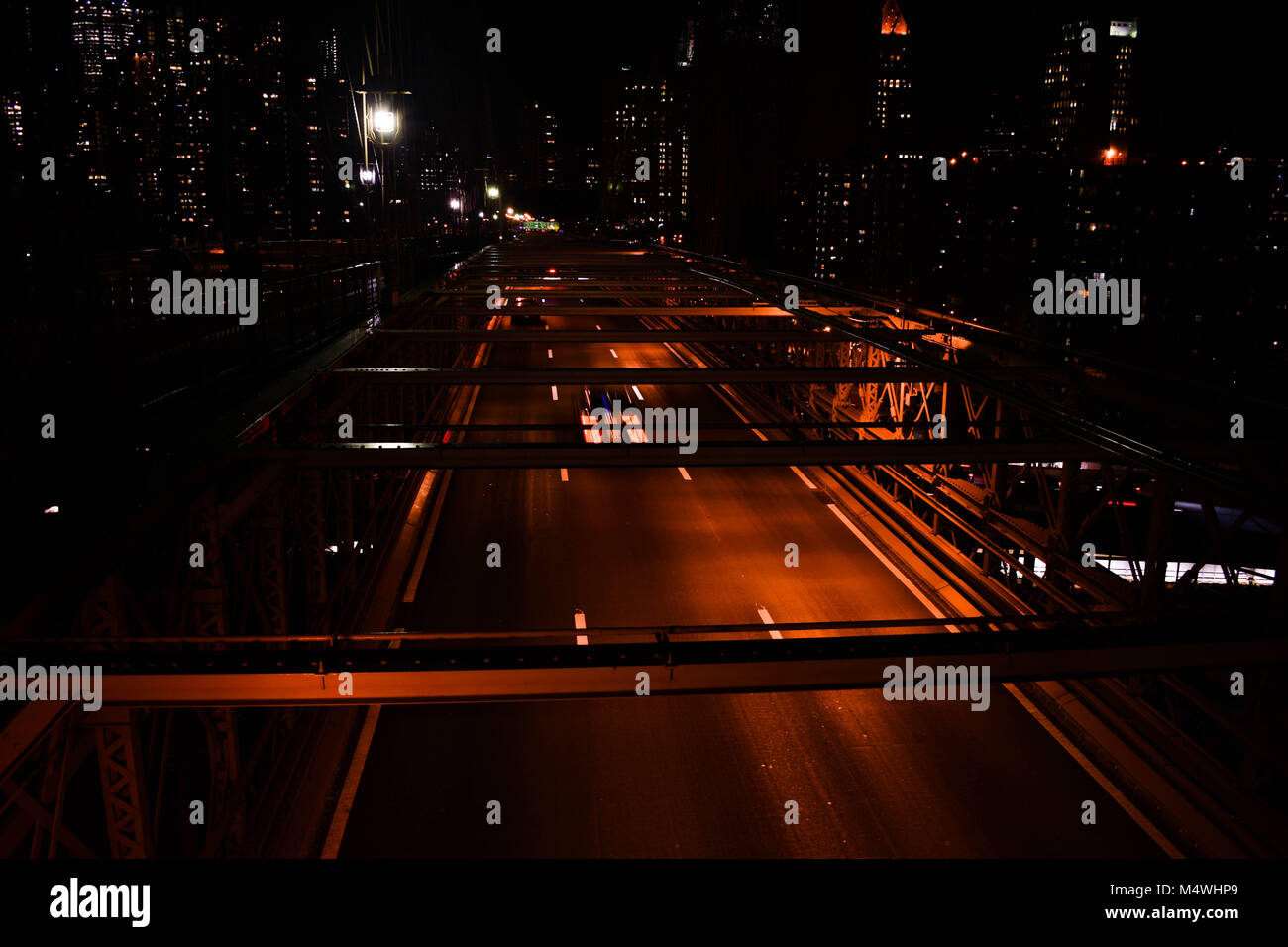 Cars passing on a bridge at night Stock Photo - Alamy