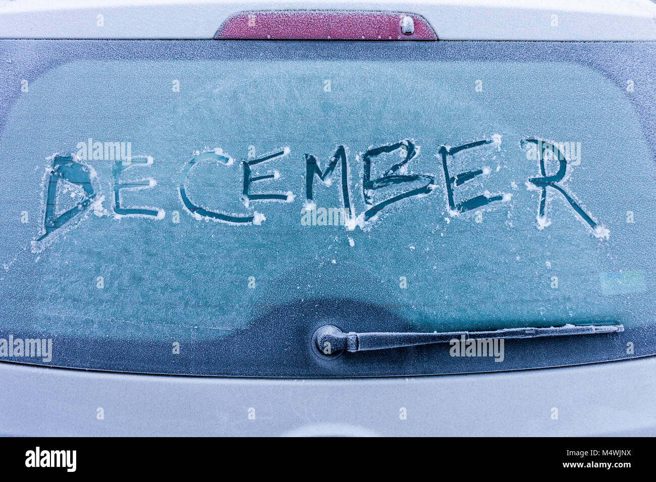 Writing in frost on rear windscreen Stock Photo - Alamy