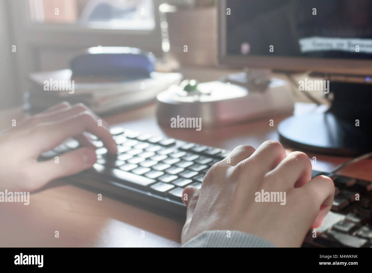 hands on keyboard on the desk Stock Photo - Alamy