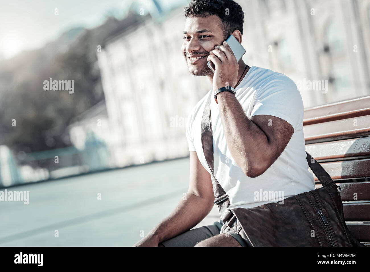 Happy joyful man making a call Stock Photo - Alamy