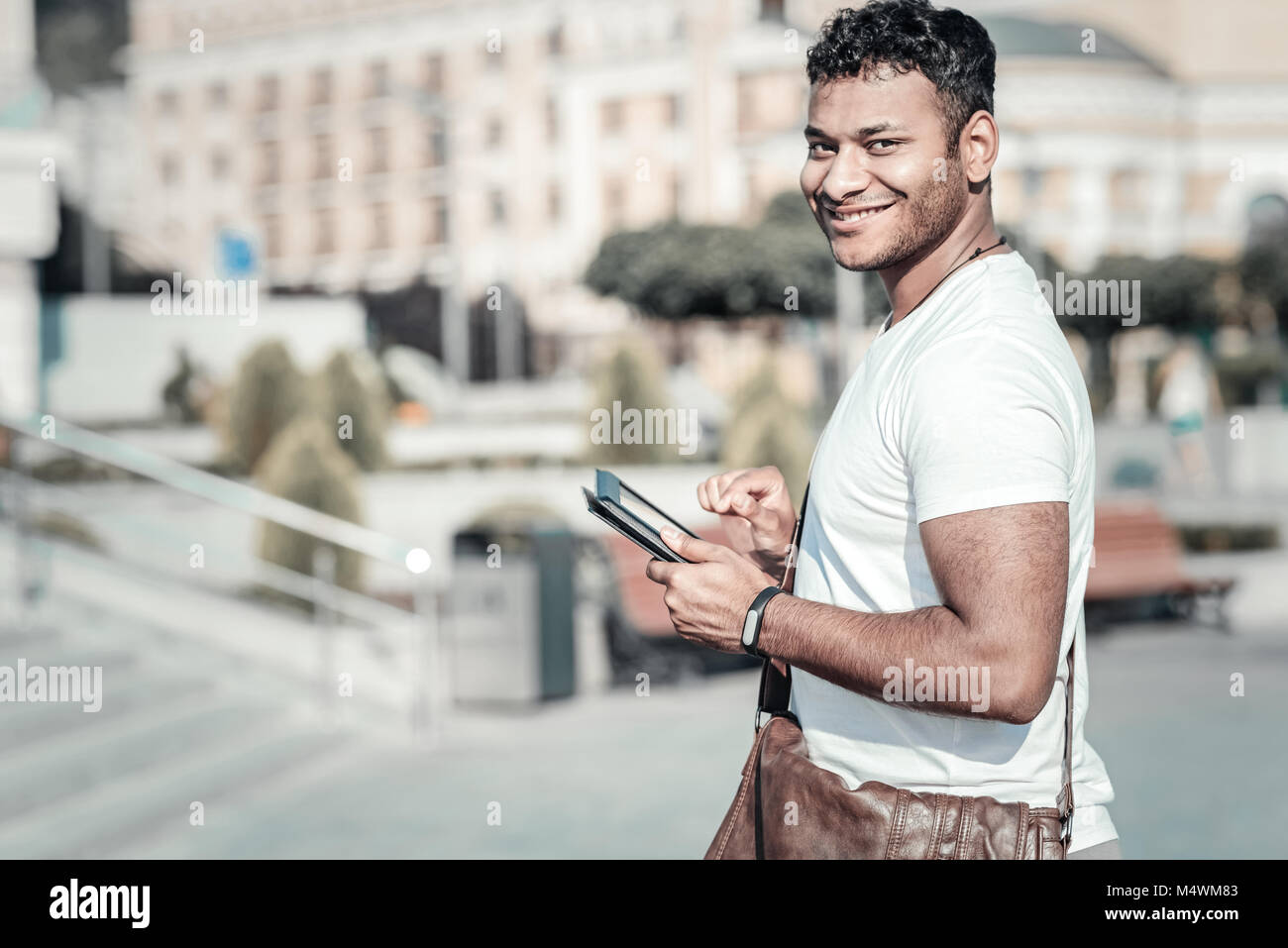 Nice joyful man smiling Stock Photo - Alamy