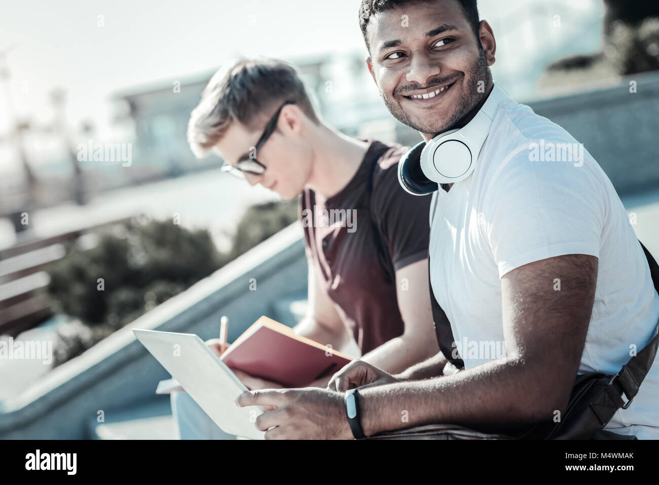 Happy positive man looking aside Stock Photo - Alamy