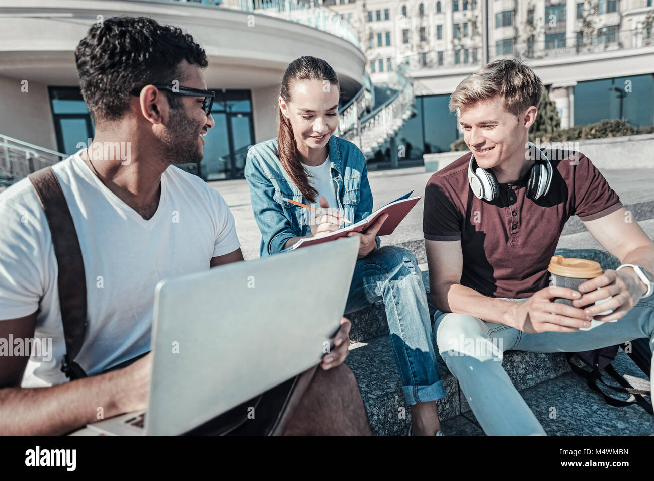 Nice happy woman taking notes Stock Photo - Alamy