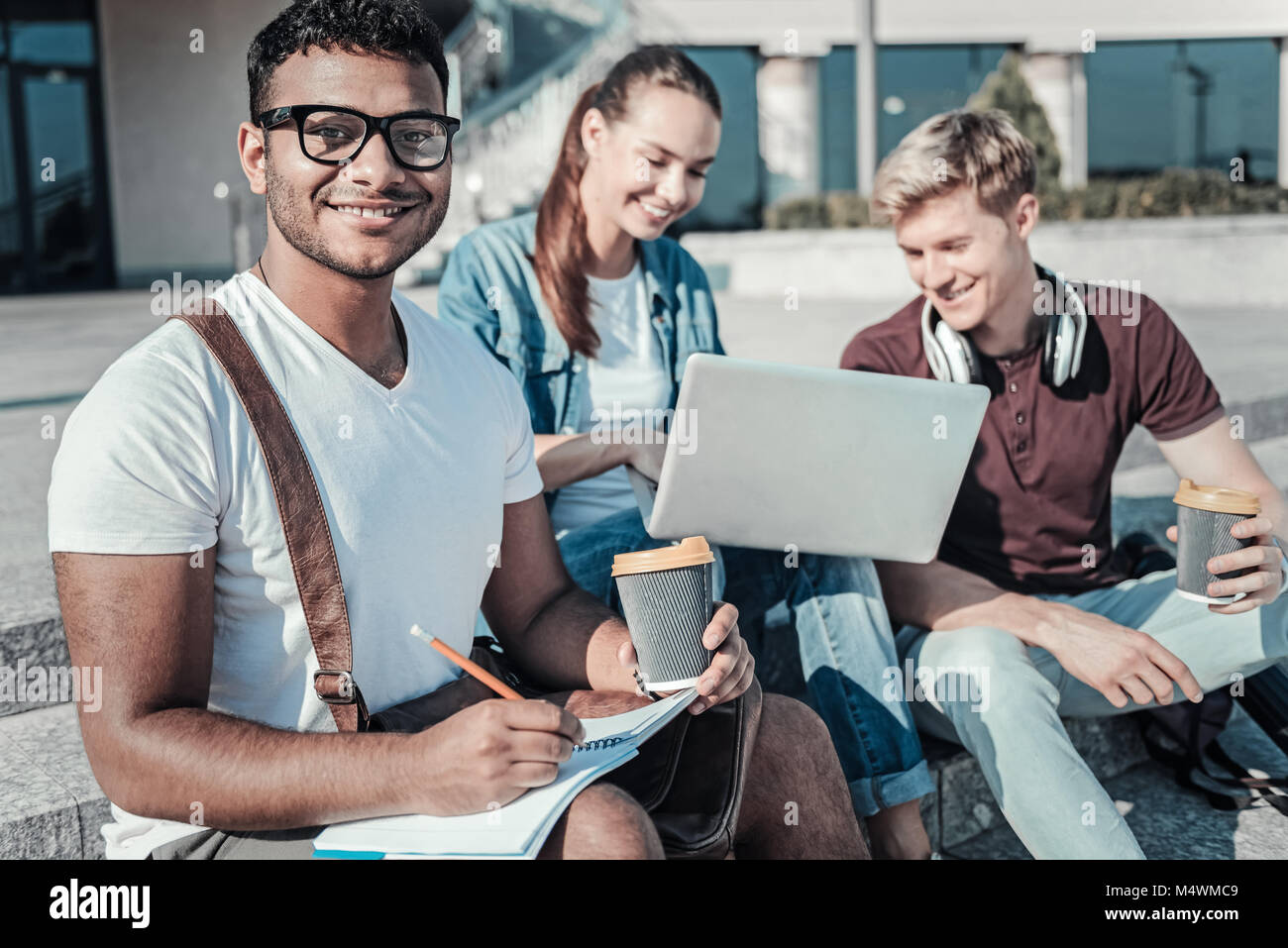 Handsome smart man holding his notes Stock Photo - Alamy