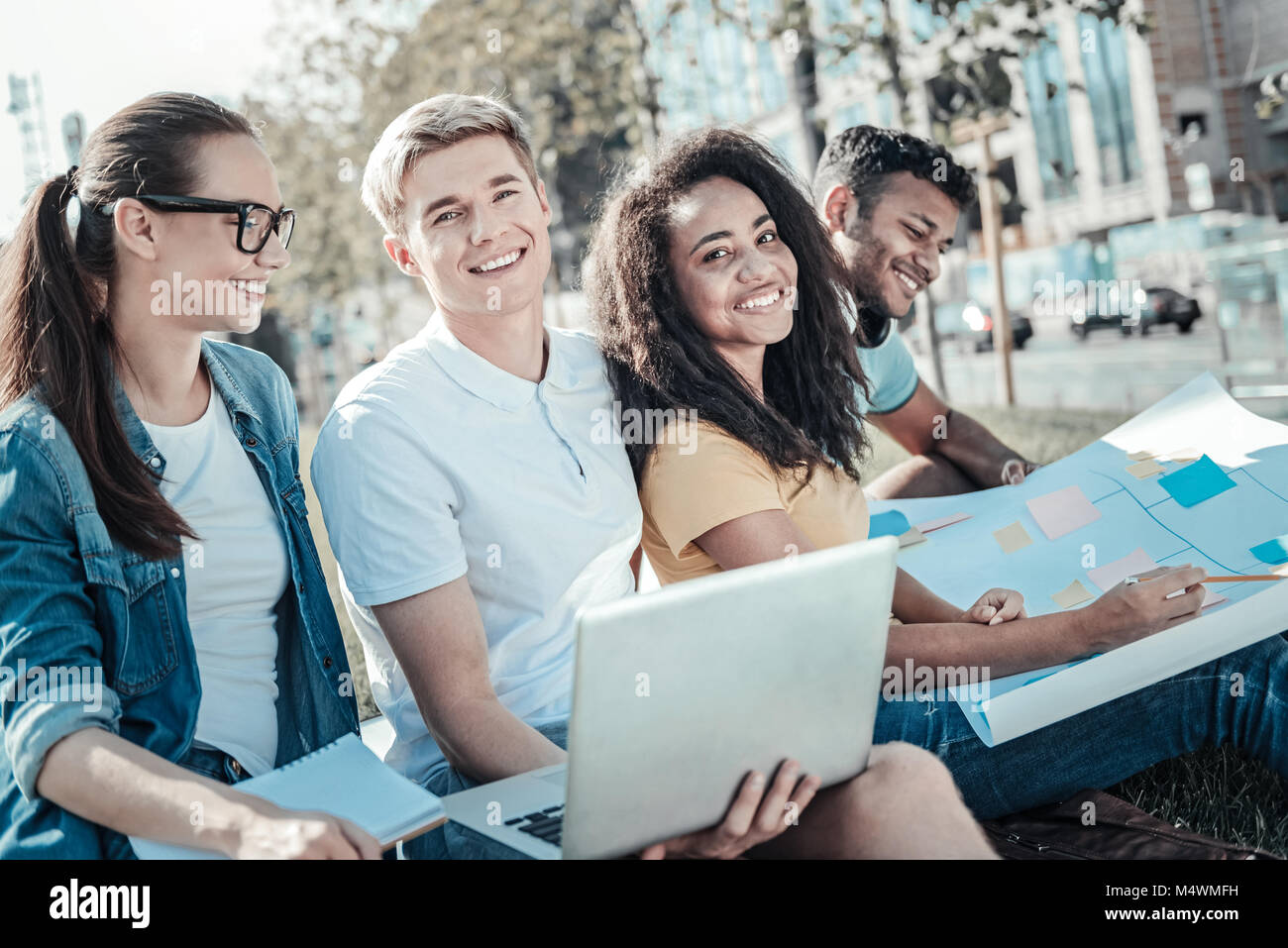 Nice happy students studying together Stock Photo - Alamy