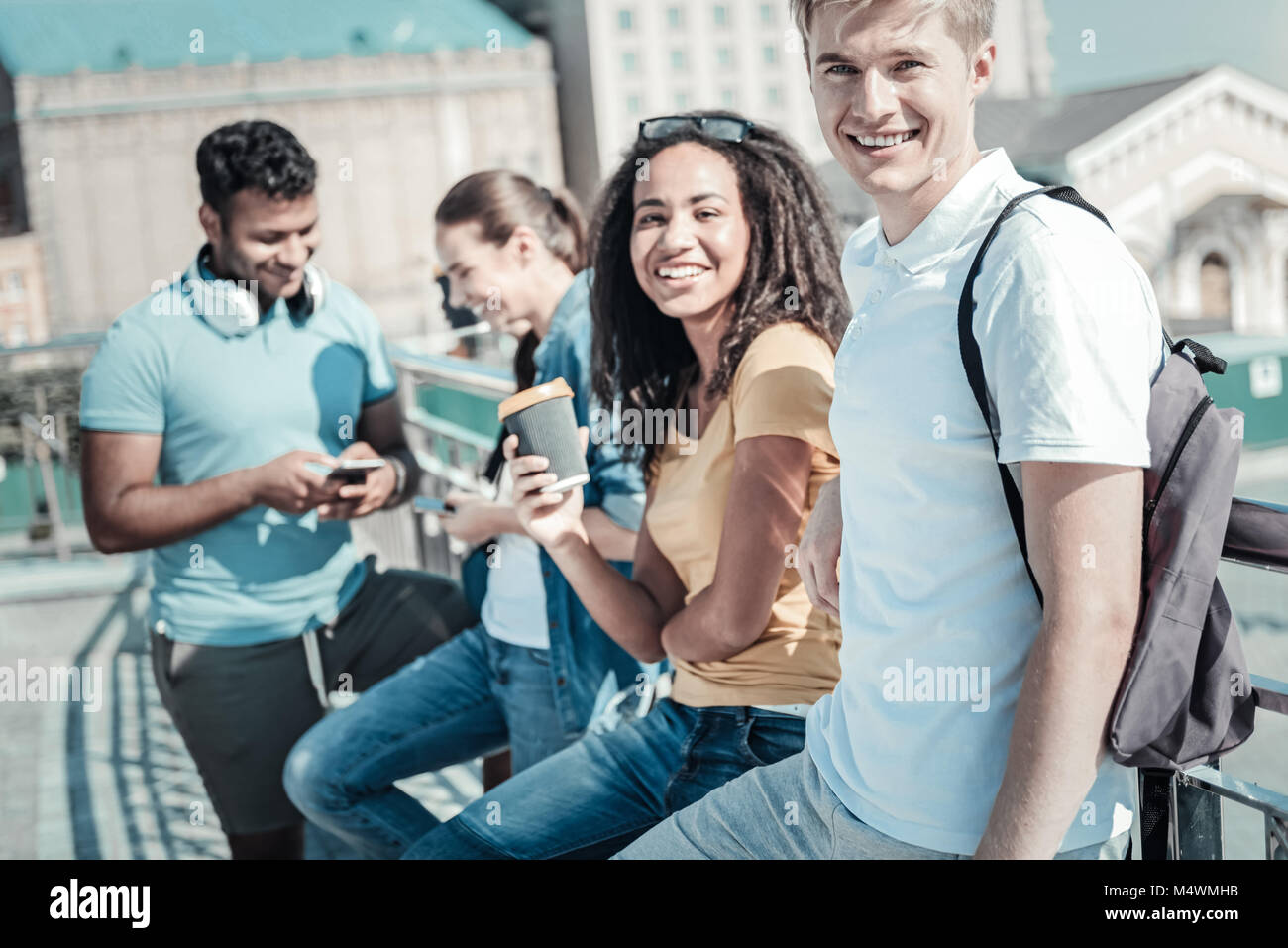 Happy delighted students standing together Stock Photo - Alamy