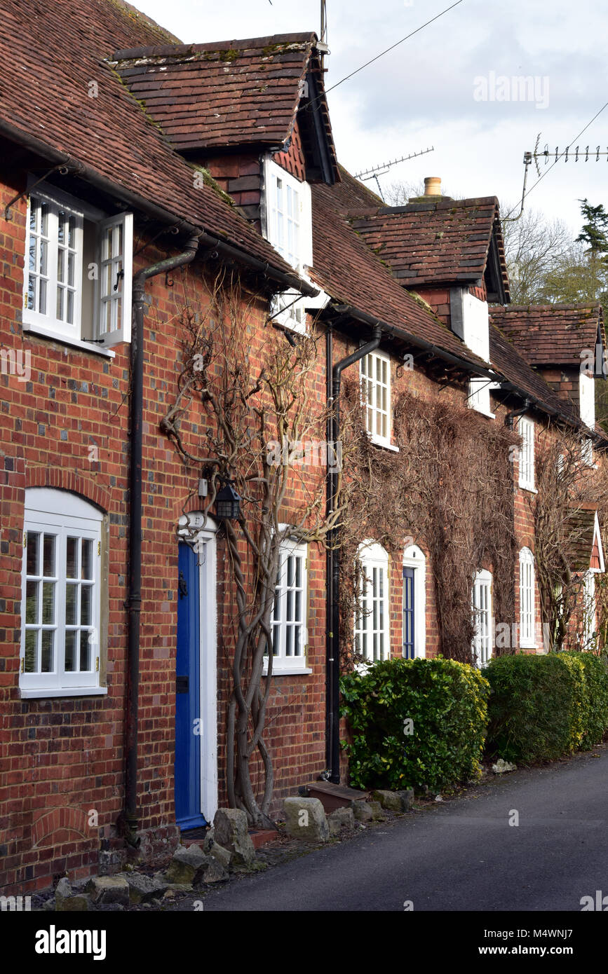 A row of typically English country cottages in a terrace and ...