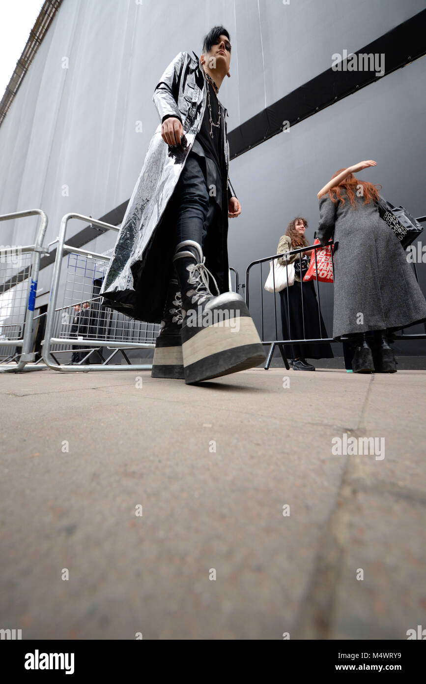 London Fashion Week venue The Store in The Strand. Male in huge boots ...