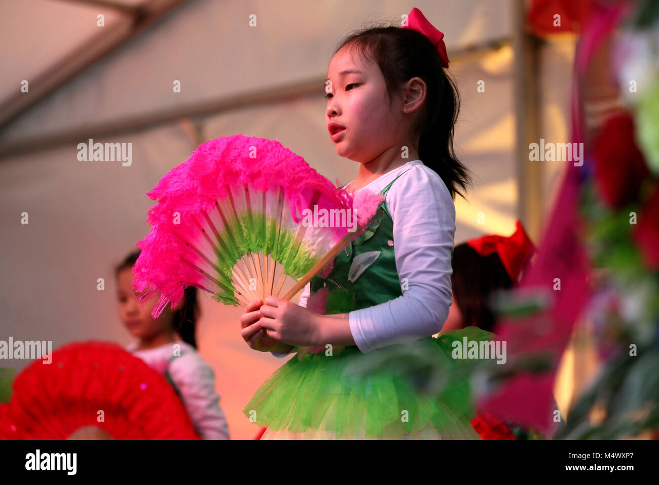 A young girl doing a fan dance, Chinatown, Manchester, 18th February ...