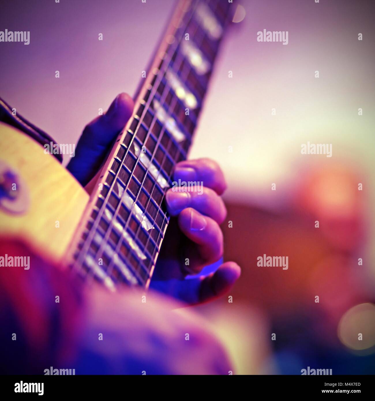 Plays electric guitar hi-res stock photography and images - Alamy