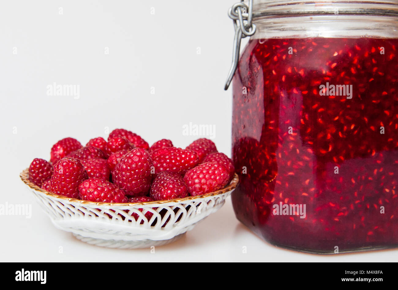 raspberry jam in jar isolated Stock Photo - Alamy