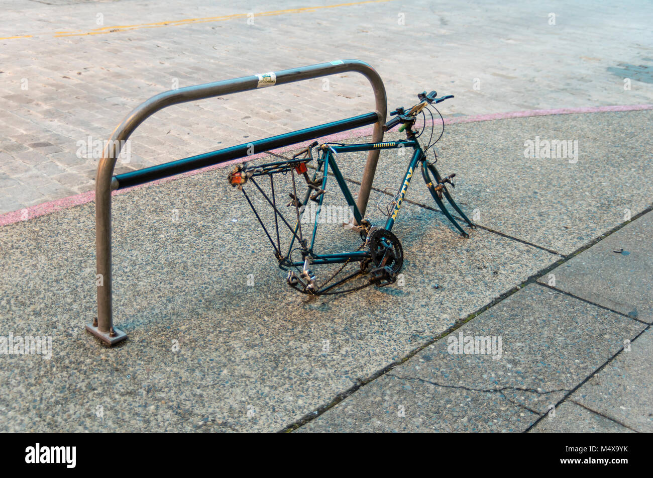 Bicycle rack with bicycle frame with wheels stripped and stolen ...