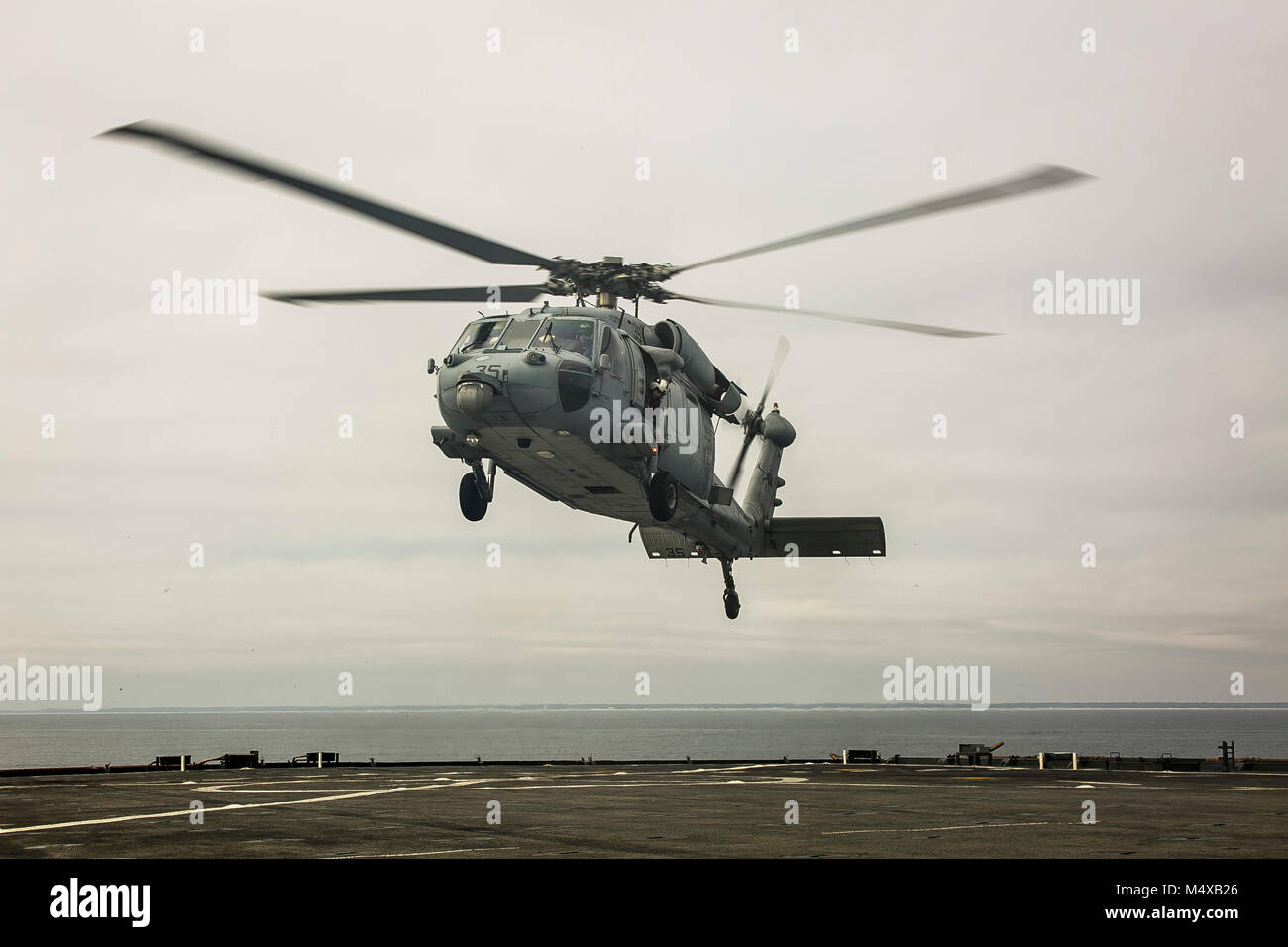 A U.S. Navy MH-60S Seahawk helicopter with Helicopter Sea Combat ...