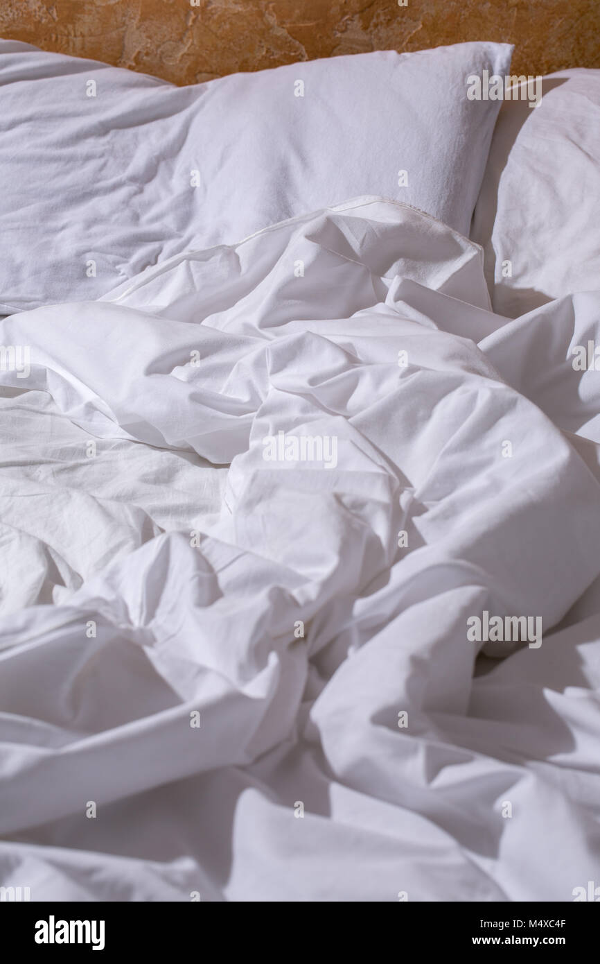 a crumpled white bed Stock Photo - Alamy