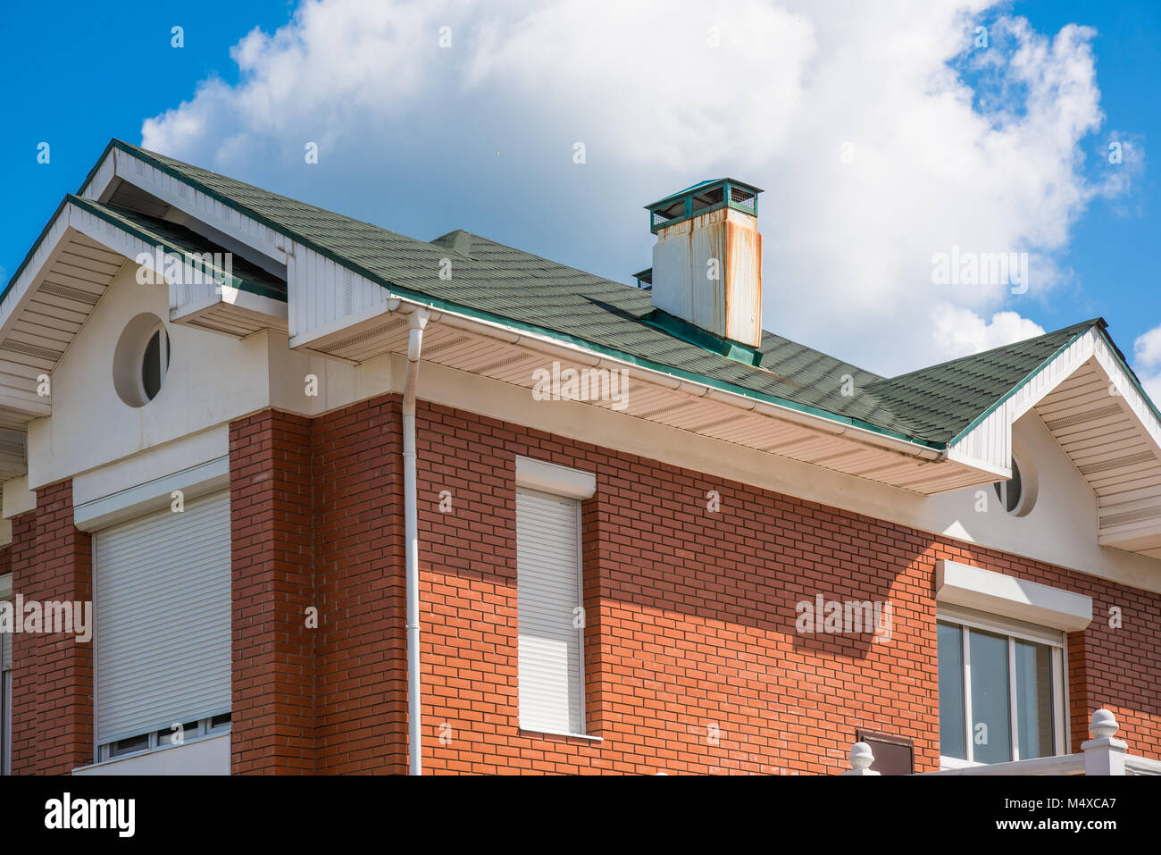 house with a gable roof window Stock Photo - Alamy