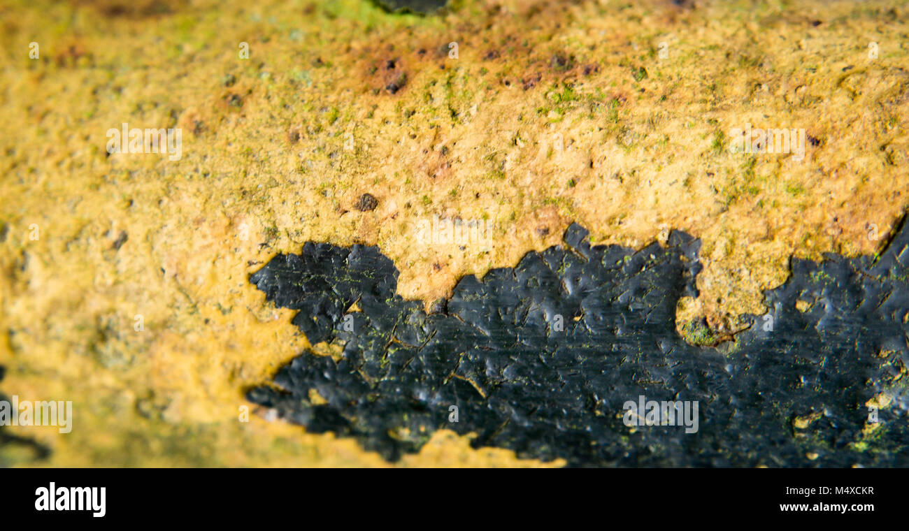 rusty metal part with rests of black paint Stock Photo - Alamy