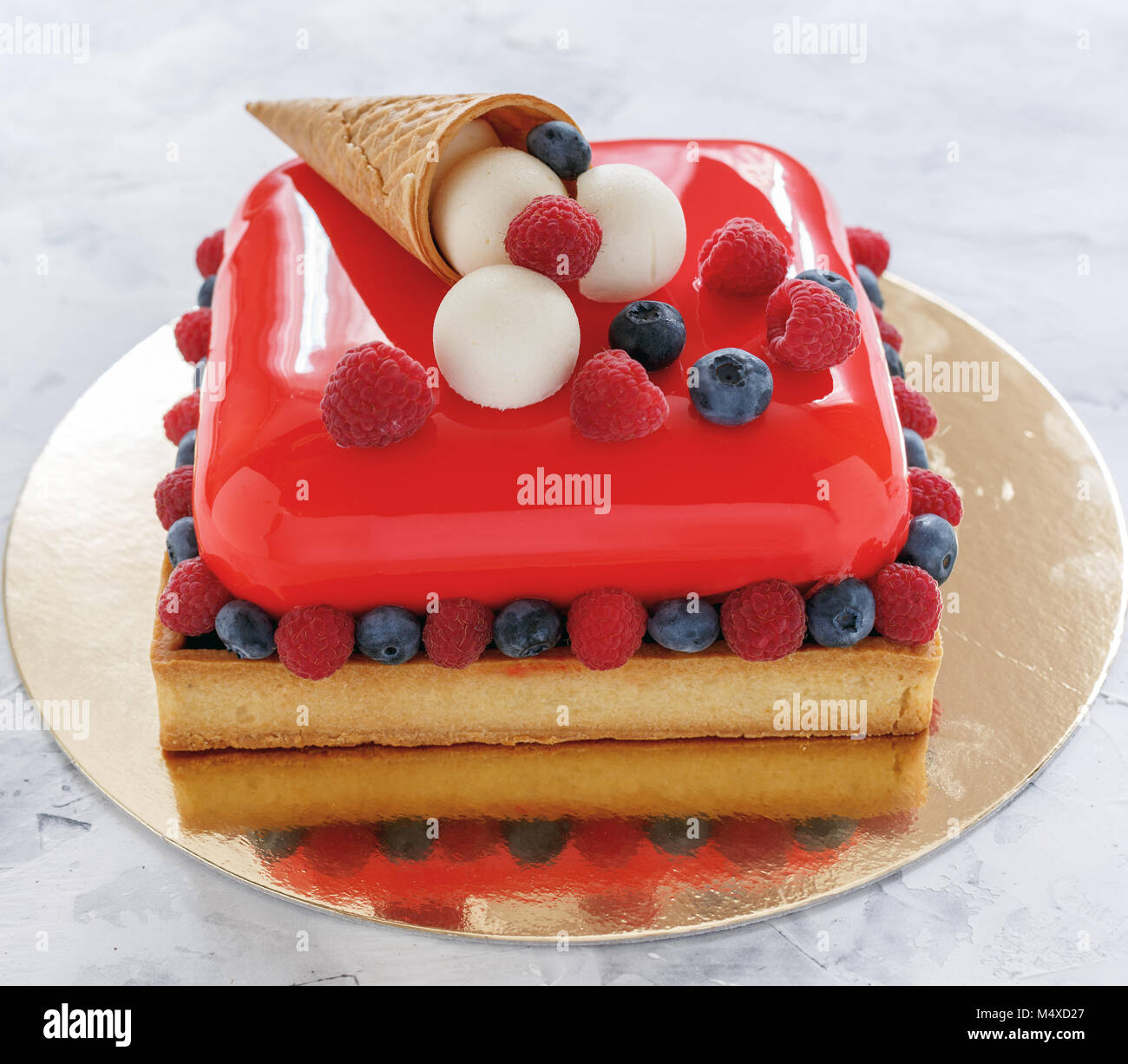 Birthday cake with red icing Stock Photo - Alamy