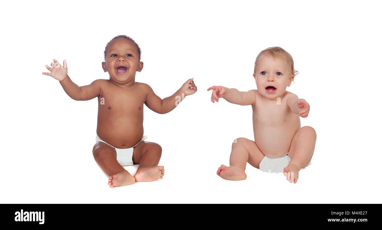 Two happy babies of different races isolated on a white background ...