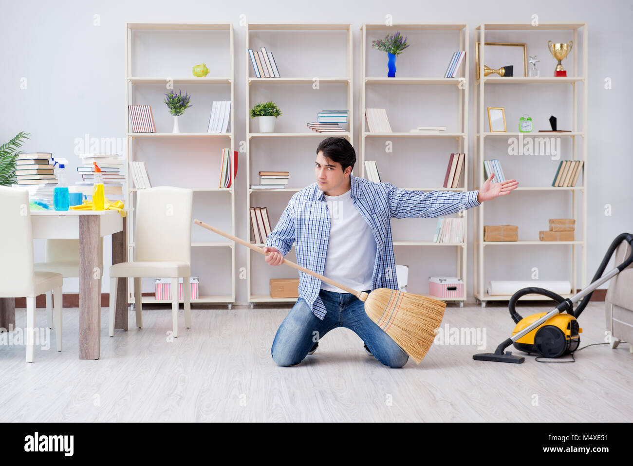 Man doing cleaning at home Stock Photo - Alamy