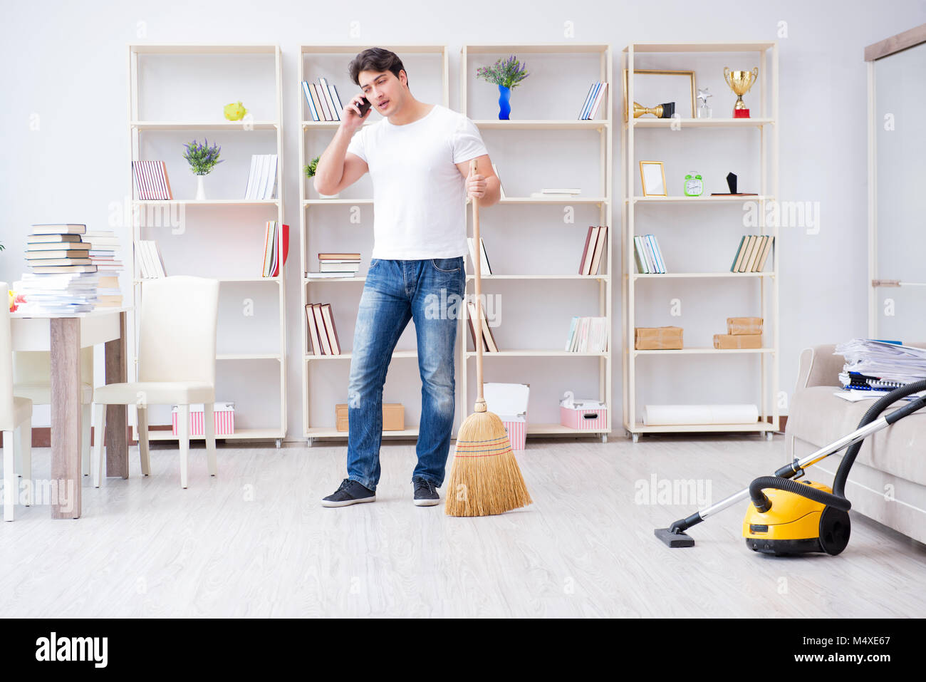 Man doing cleaning at home Stock Photo - Alamy