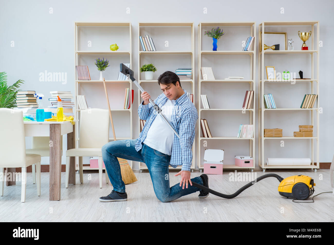 Man doing cleaning at home Stock Photo - Alamy